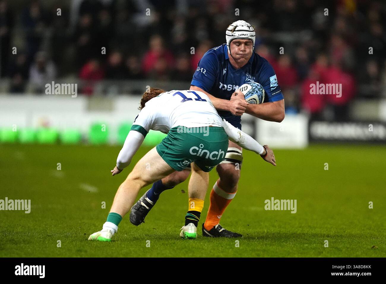Sale Sharks' Ernst van Rhyn (right) is tackled by Northampton Saints ...