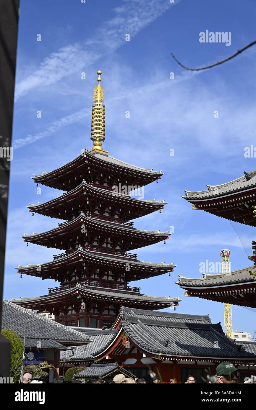 Traditional Japanese pagoda and temple roof at Senso-ji Temple in Asakusa, Tokyo, Japan – blue ...