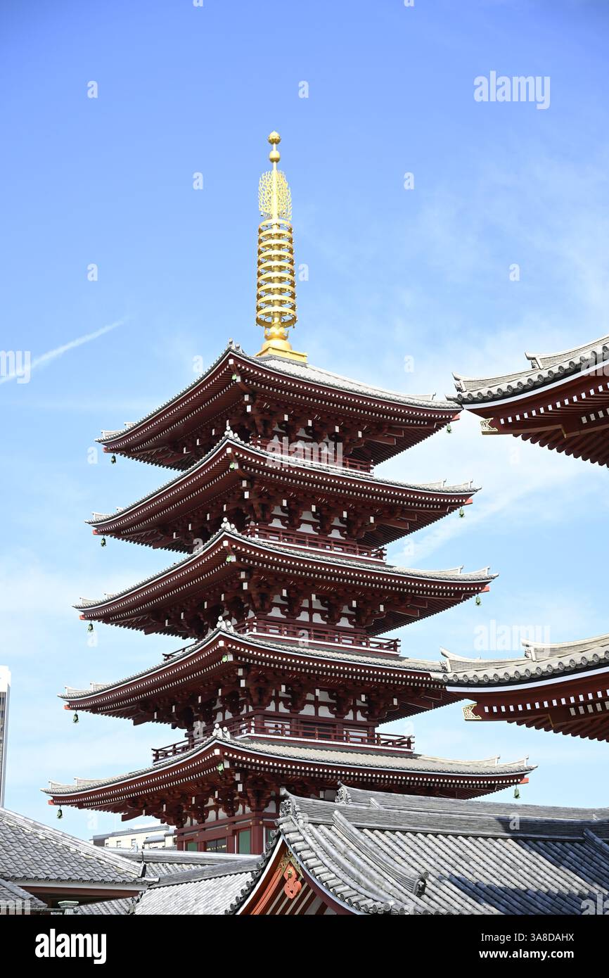 Traditional Japanese pagoda and temple roof at Senso-ji Temple in Asakusa, Tokyo, Japan – blue ...