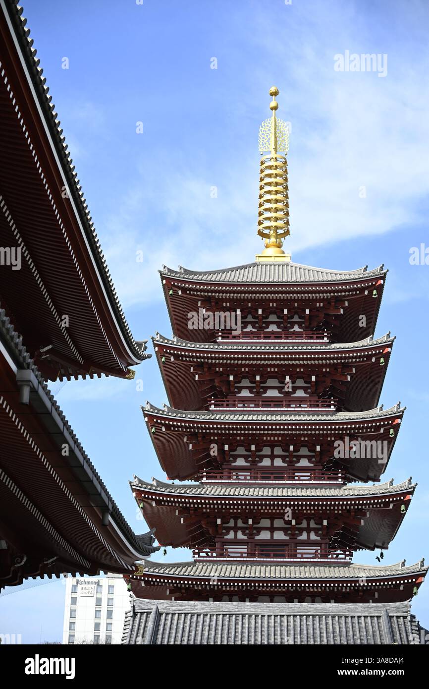 Traditional Japanese pagoda and temple roof at Senso-ji Temple in Asakusa, Tokyo, Japan – blue ...
