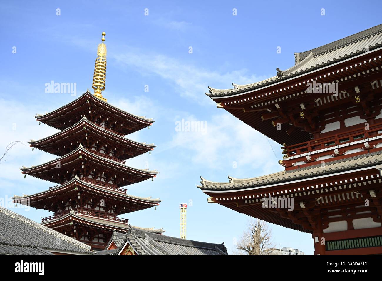 Traditional Japanese pagoda and temple roof at Senso-ji Temple in Asakusa, Tokyo, Japan – blue ...