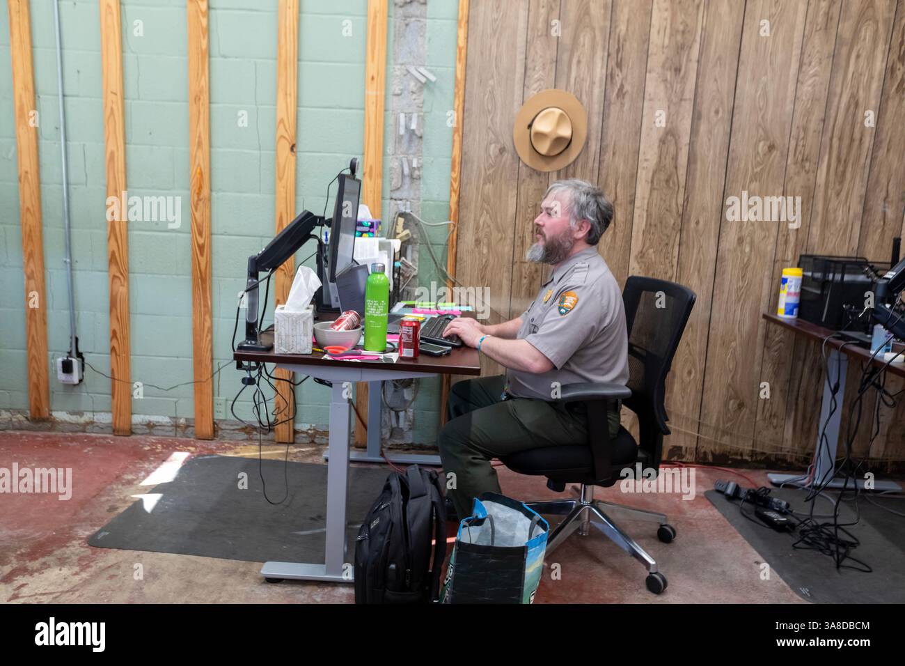 Anniston, Alabama - A National Park Service employee works on clerical ...