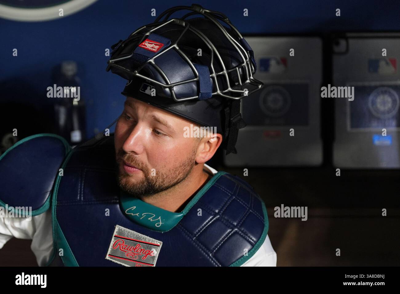 Seattle Mariners catcher Cal Raleigh sits in the dugout before an ...