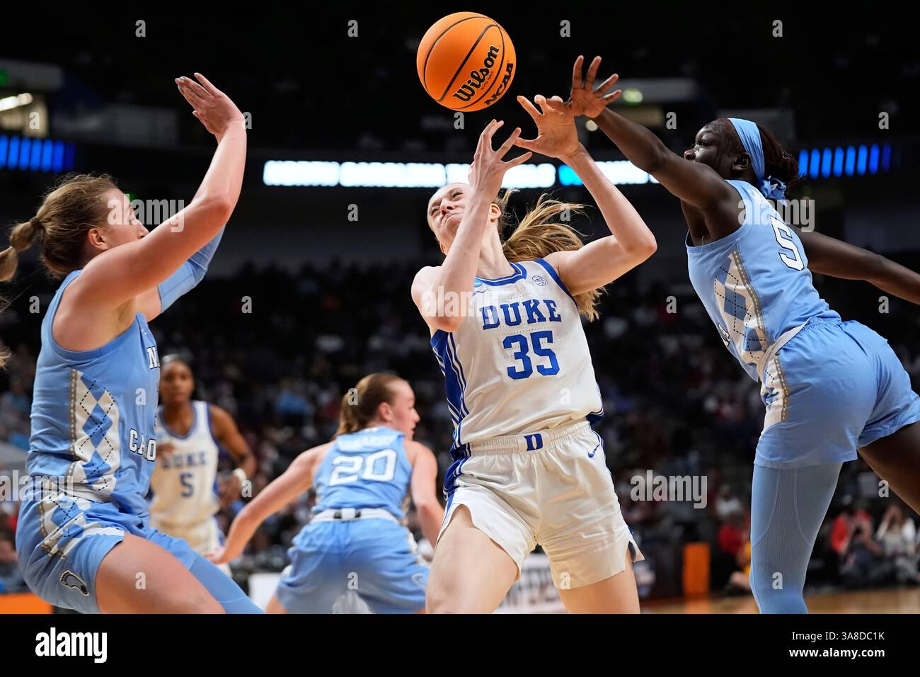 Duke forward Toby Fournier (35) battles for the ball between North ...