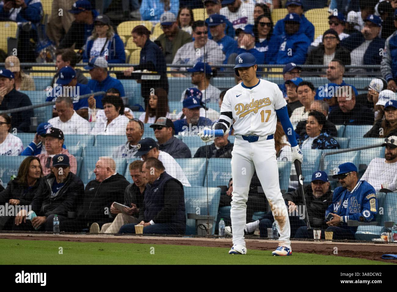 Los Angeles Dodgers' Shohei Ohtani sprays bat spray from on-deck during ...