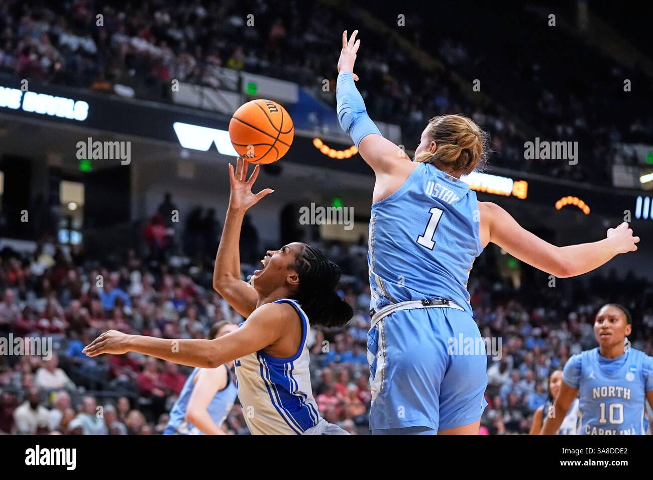 North Carolina guard Alyssa Ustby (1) moves to block a shot by Duke ...