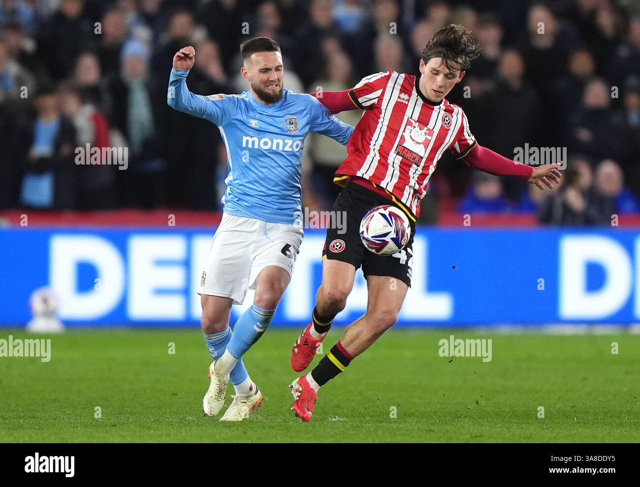 Coventry City's Matt Grimes (left) and Sheffield United's Sydie Peck ...