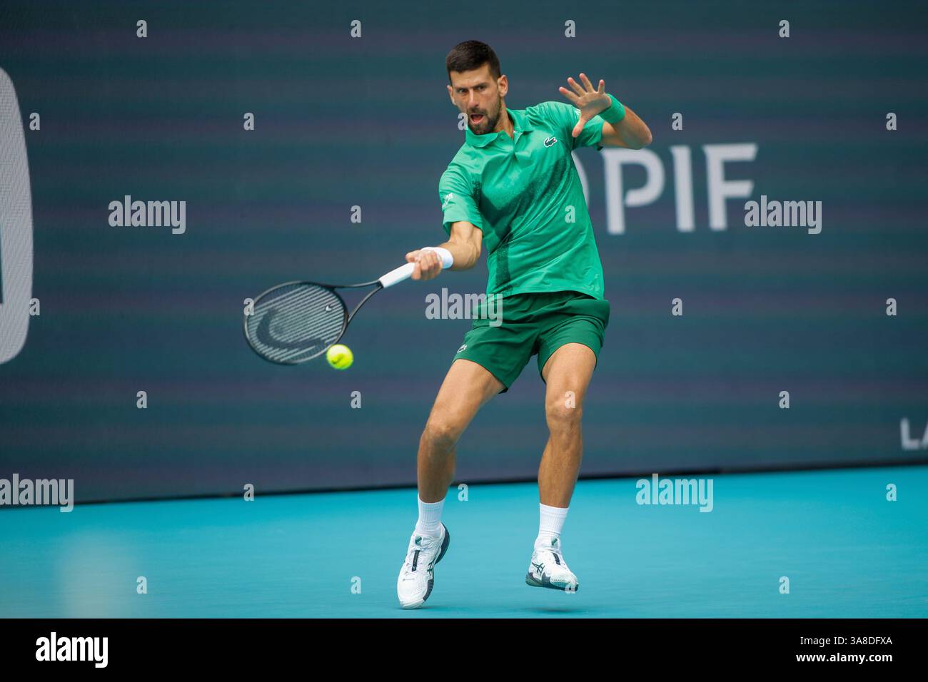 MIAMI GARDENS, FL - MARCH 28: Novak Djokovic (SRB) in action against ...