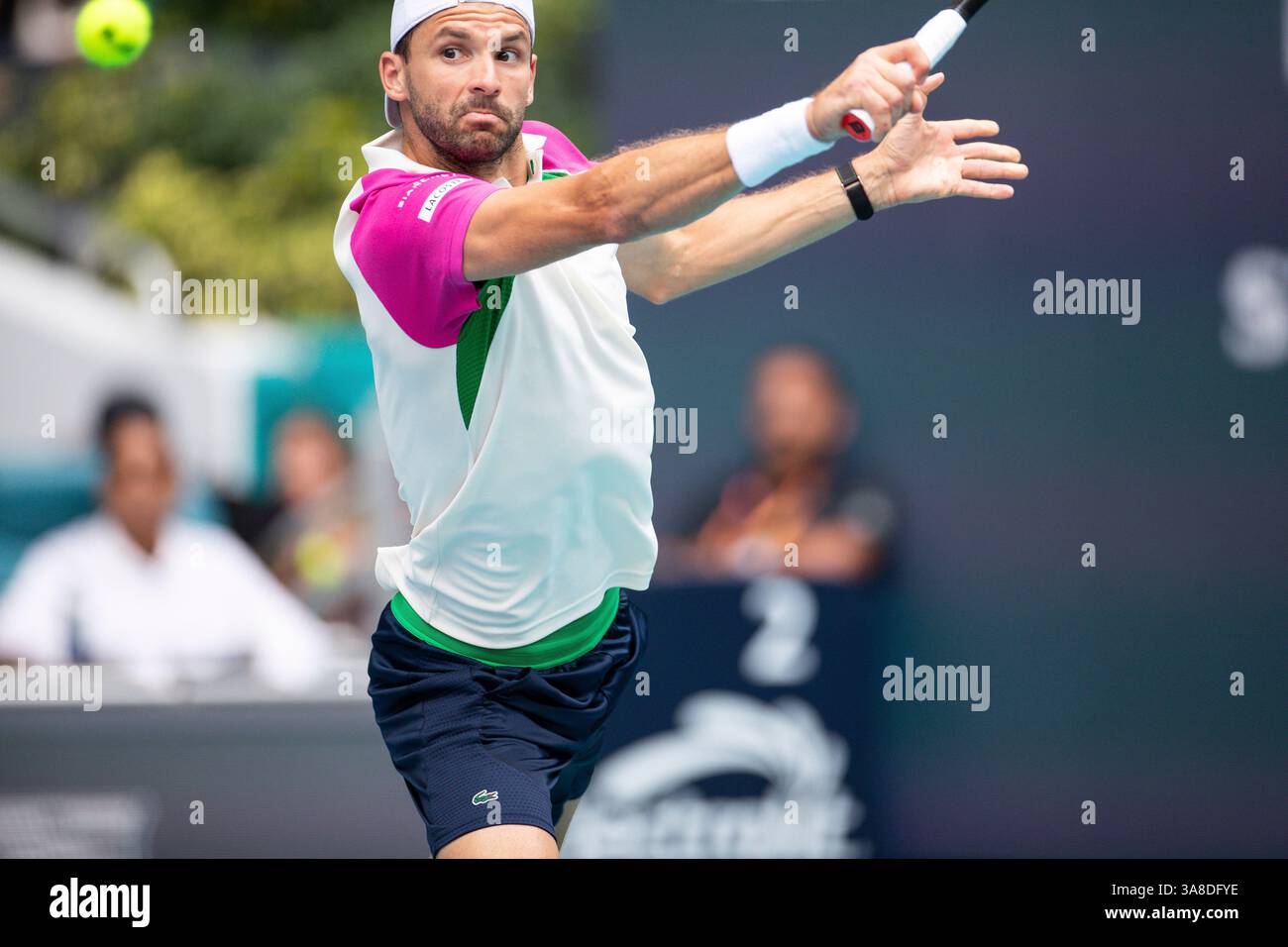 Grigor Dimitrov of Bulgaria returns the ball in the Men's Singles ...