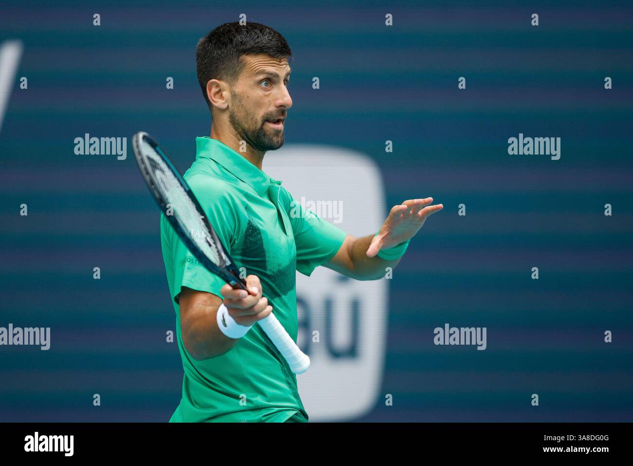 MIAMI GARDENS, FL - MARCH 28: Novak Djokovic (SRB) in action against ...