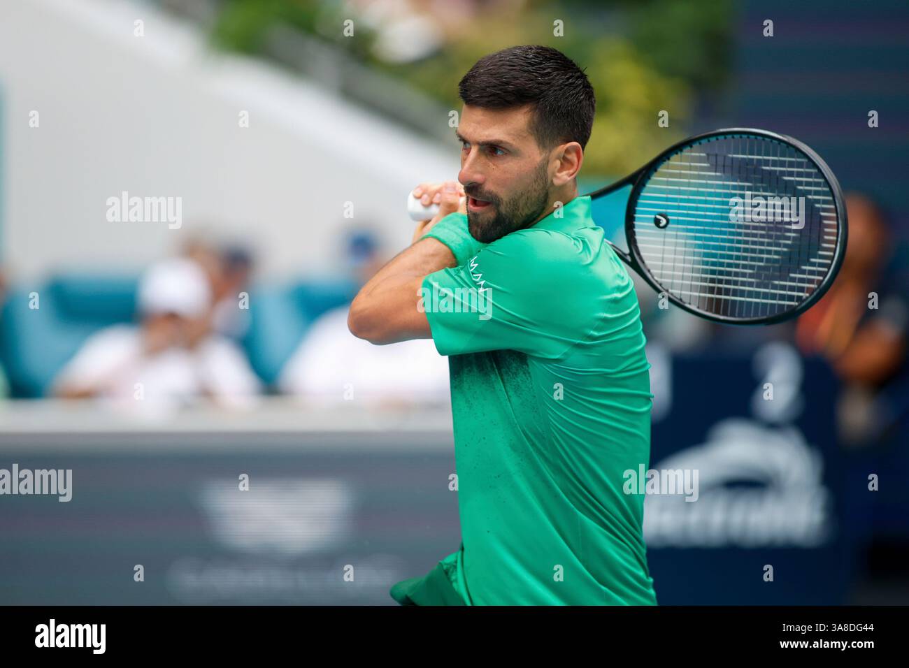 MIAMI GARDENS, FL - MARCH 28: Novak Djokovic (SRB) in action against ...