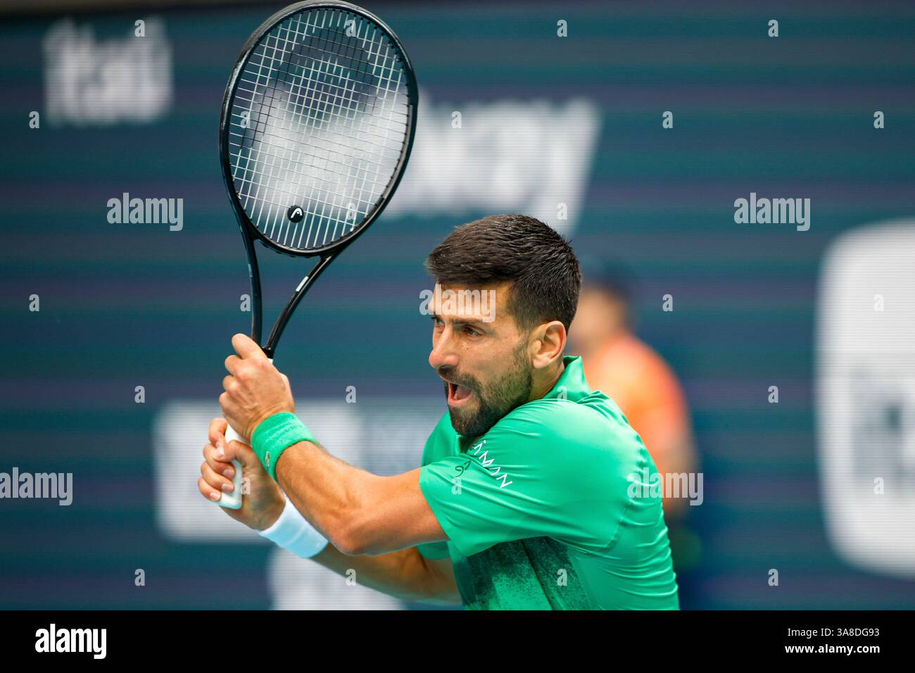 MIAMI GARDENS, FL - MARCH 28: Novak Djokovic (SRB) in action against ...
