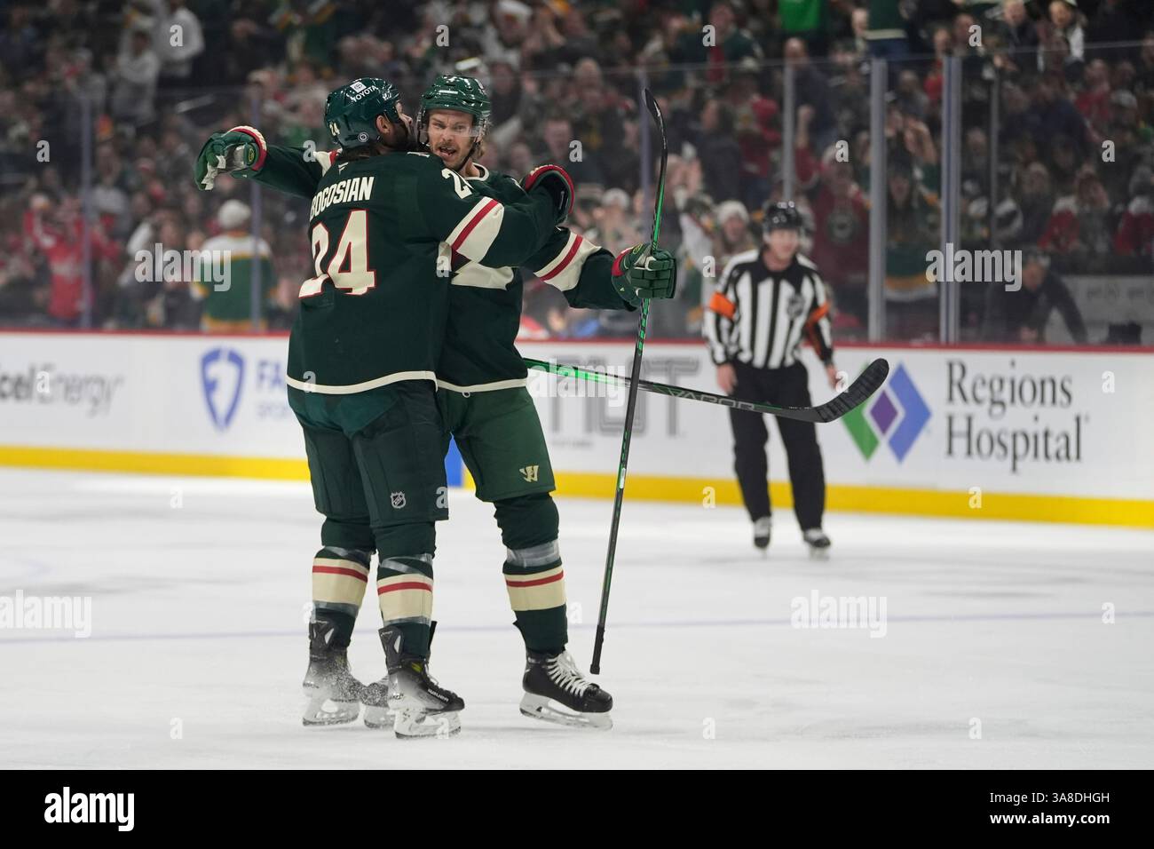 Minnesota Wild defenseman Jon Merrill (4) celebrates with defenseman ...