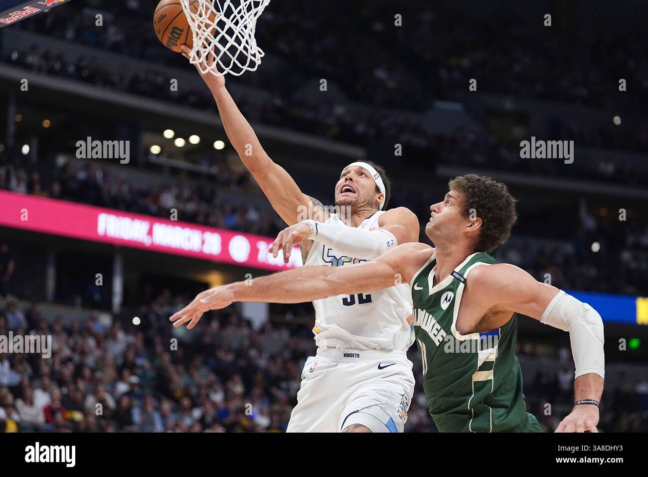 Denver Nuggets forward Aaron Gordon (32) and Milwaukee Bucks center ...