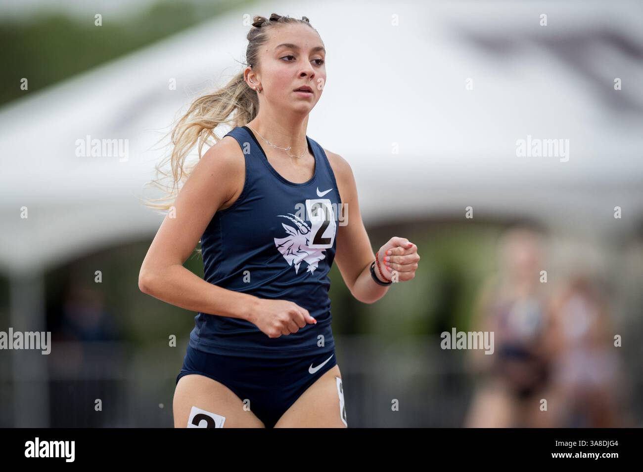 March 27, 2025: St. Edward's Hilltoppers runner Megan Ferrell competes ...