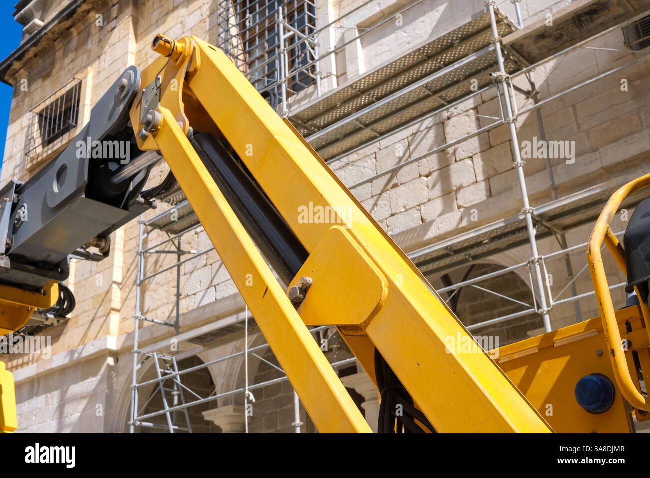 Scaffolding surrounds a historic building under renovation, with a ...