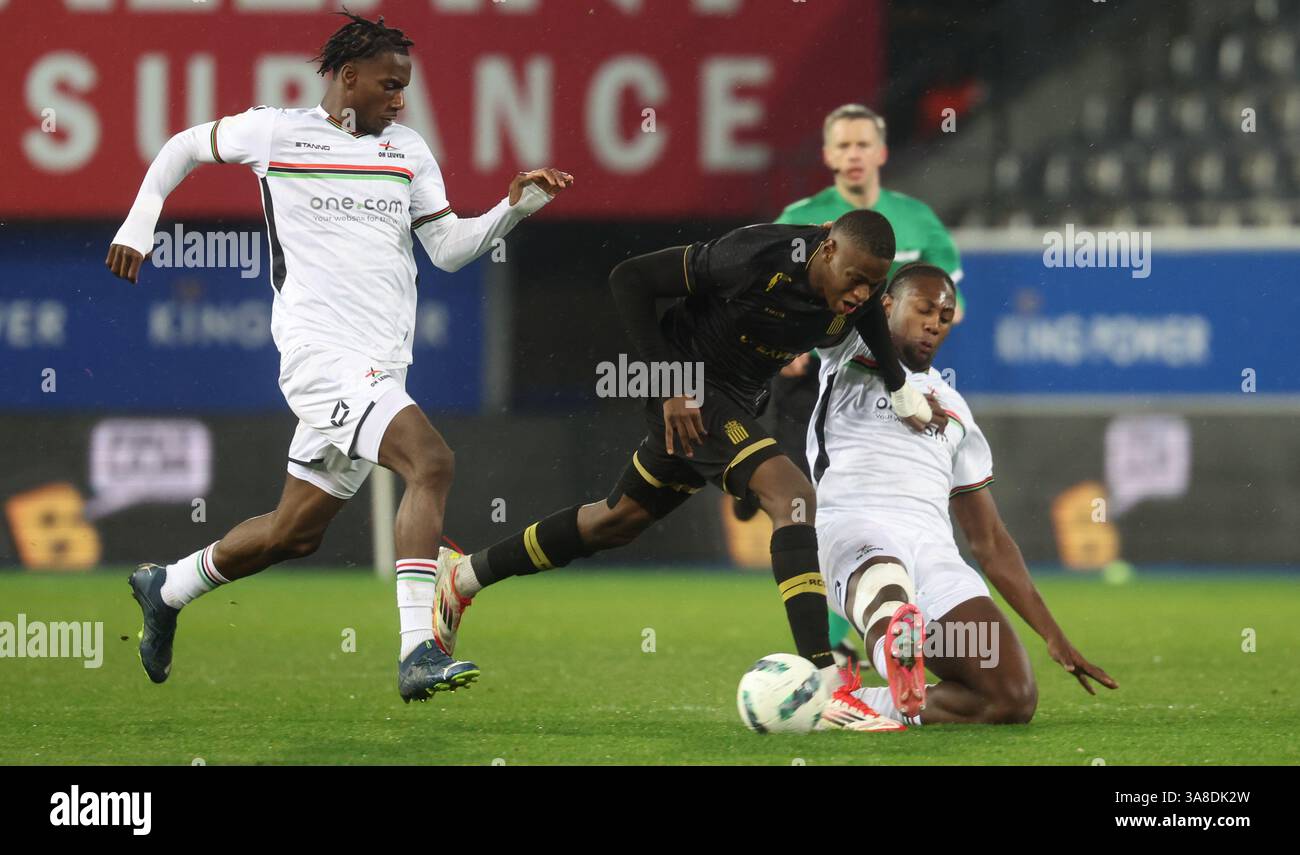Leuven, Belgium. 28th Mar, 2025. Charleroi's Massamba Sow and OHL's ...
