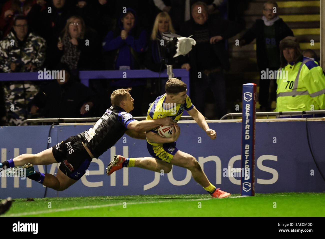 Warrington, UK. 28th Mar, 2025. Jake Thewlis of Warrington Wolves goes ...