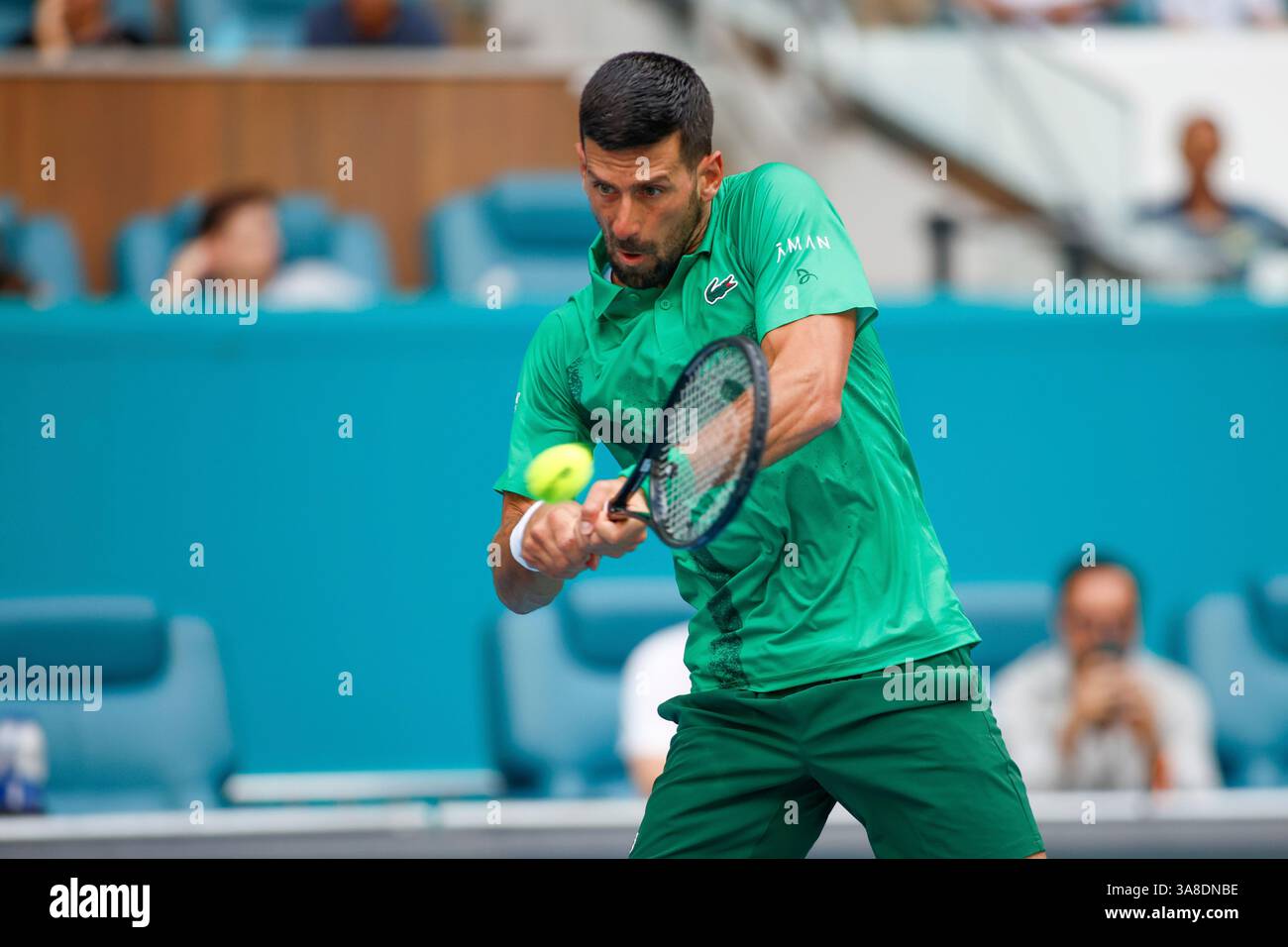 MIAMI GARDENS, FL - MARCH 28: Novak Djokovic (SRB) in action against ...