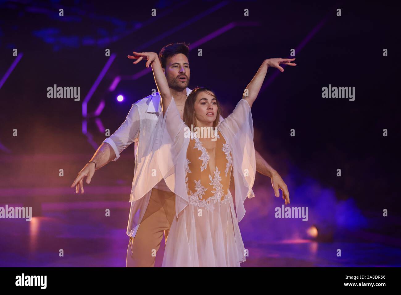 Cologne, Germany. 28th Mar, 2025. Marc Eggers, model, and Renata Lusin ...