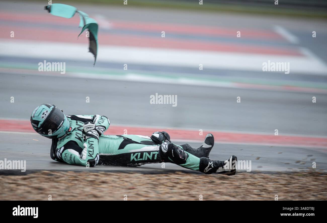 Austin, Texas, USA. 28th Mar, 2025. Moto2 Rider going down around turn ...