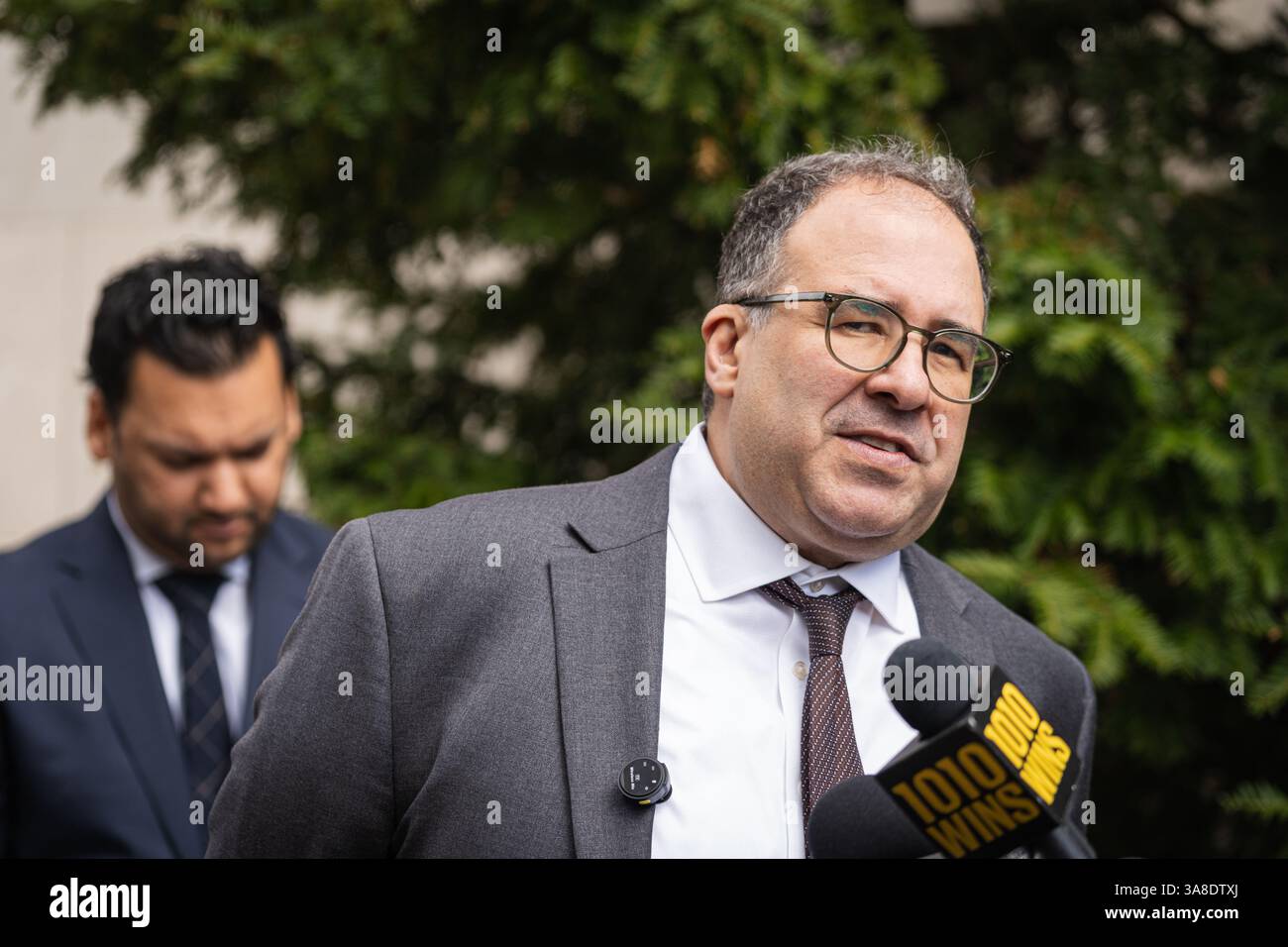 Newark, USA. 28th Mar, 2025. Defense lawyer Baher Azmy spoke to ...