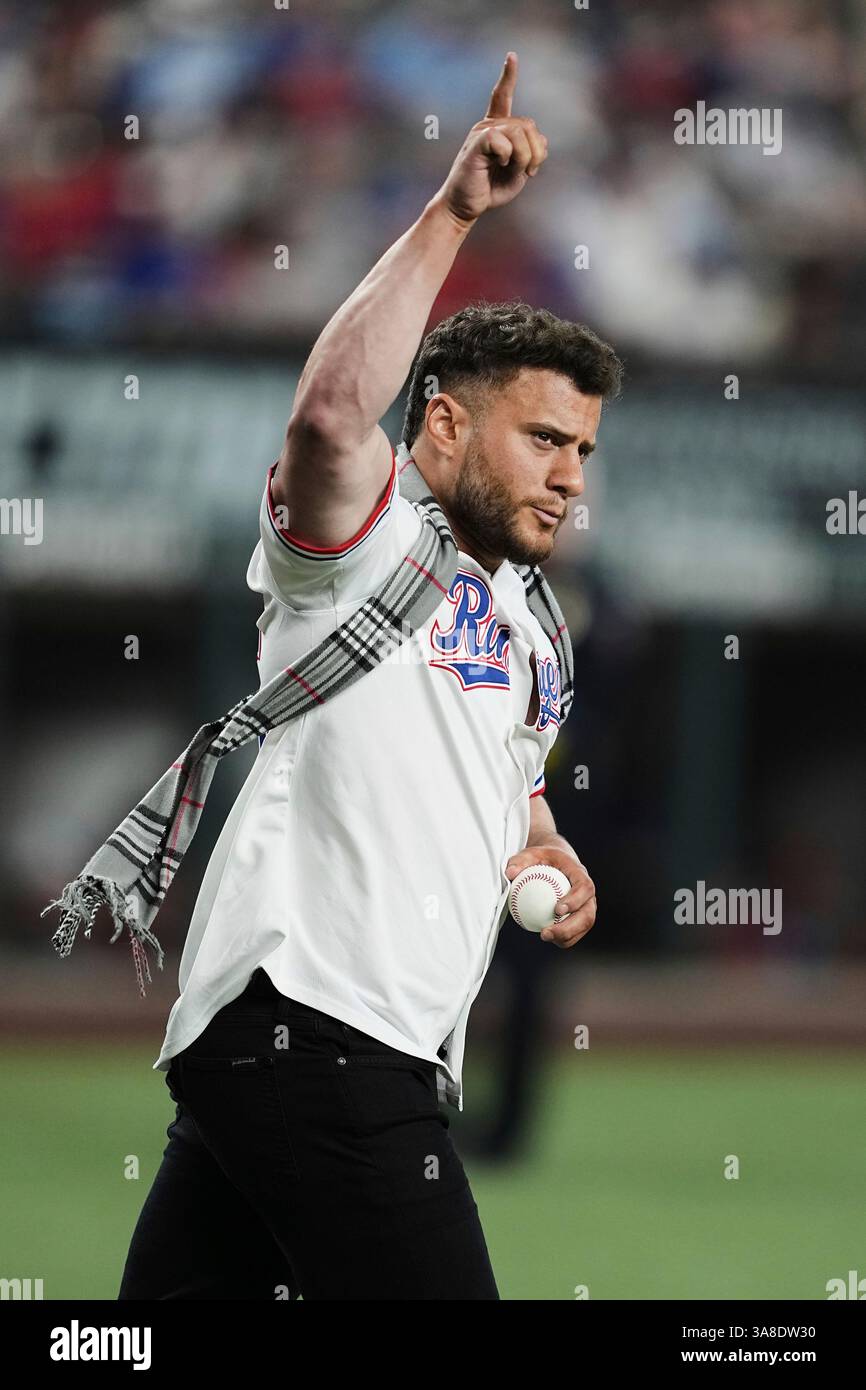 AEW wrestler Maxwell Jacob Friedman jogs onto the field to throw out ...
