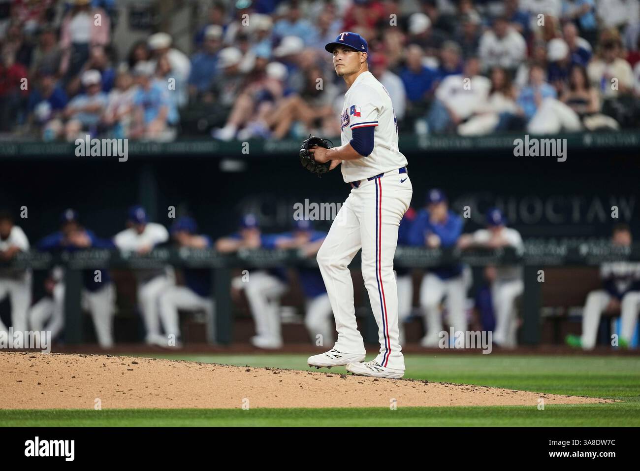 Texas Rangers' Robert Garcia walks up onto the mound as he works ...