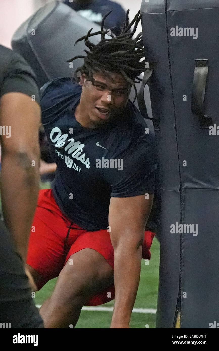 Mississippi defensive tackle Walter Nolen leans into a blocking dummy ...