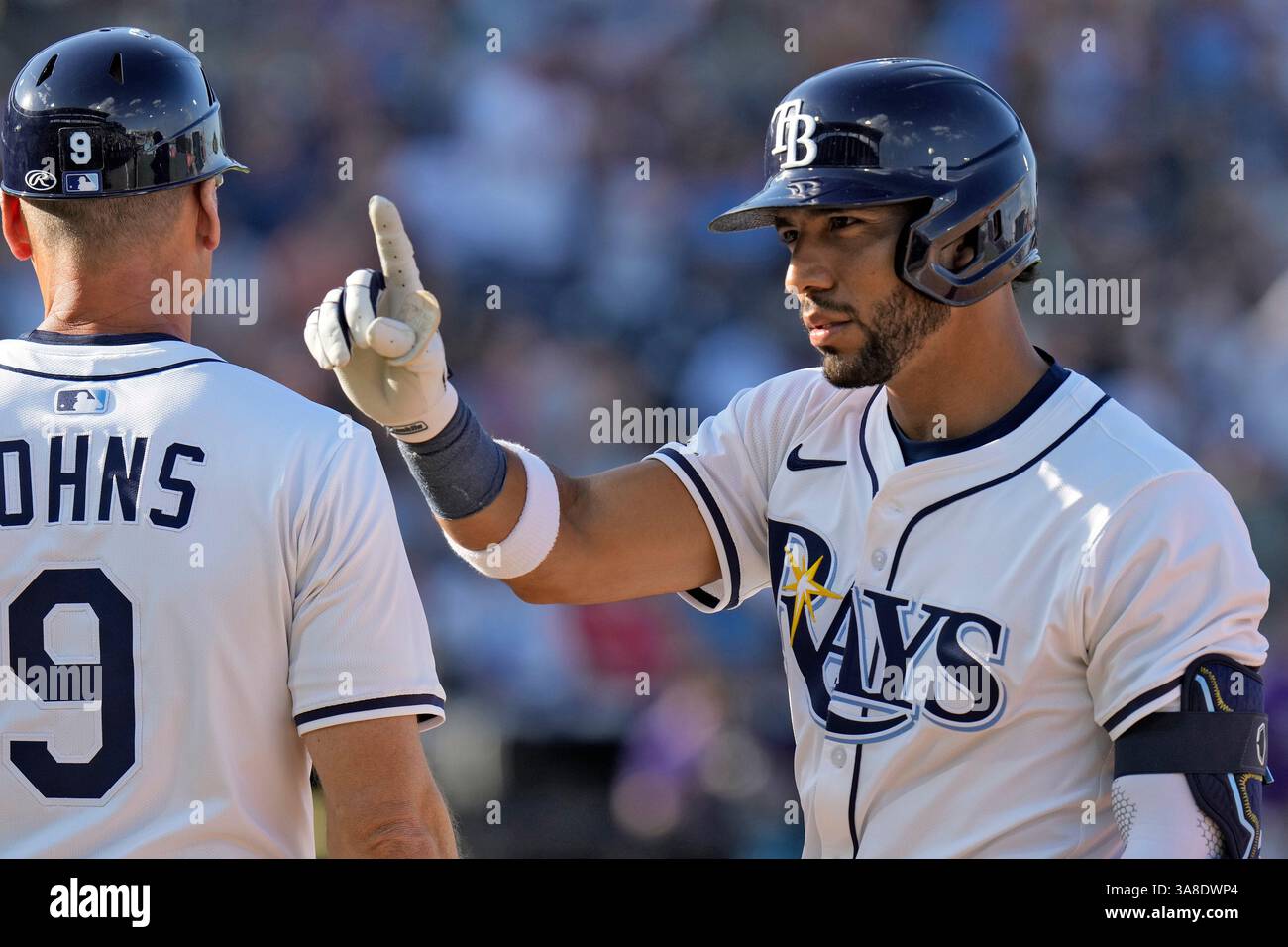 Tampa Bay Rays' José Caballero, right, celebrates with first base coach ...