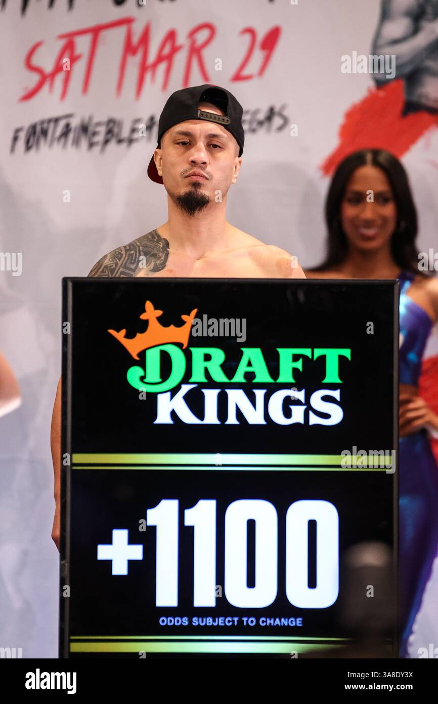 Jr. 28th Mar, 2025. Welterweight Giovannie Gonzalez stands on a scale ...