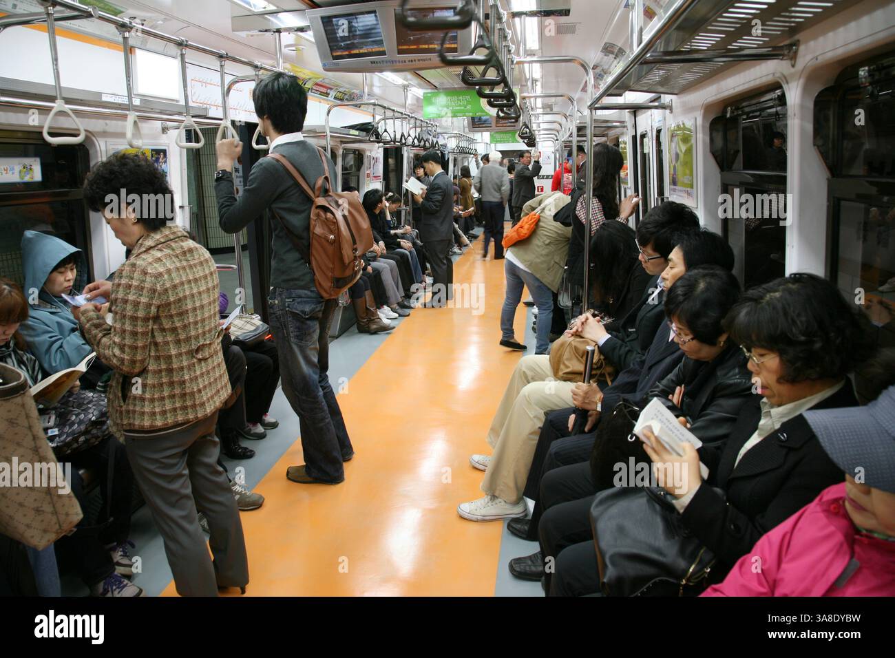 SEOUL, SOUTH KOREA. 26 APRIL, 2011. Passengers ride the Seoul subway ...