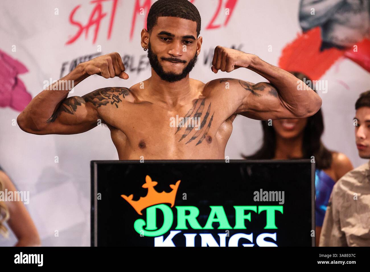 March 28, 2025: Welterweight Tiger Johnson poses on a scale during ...