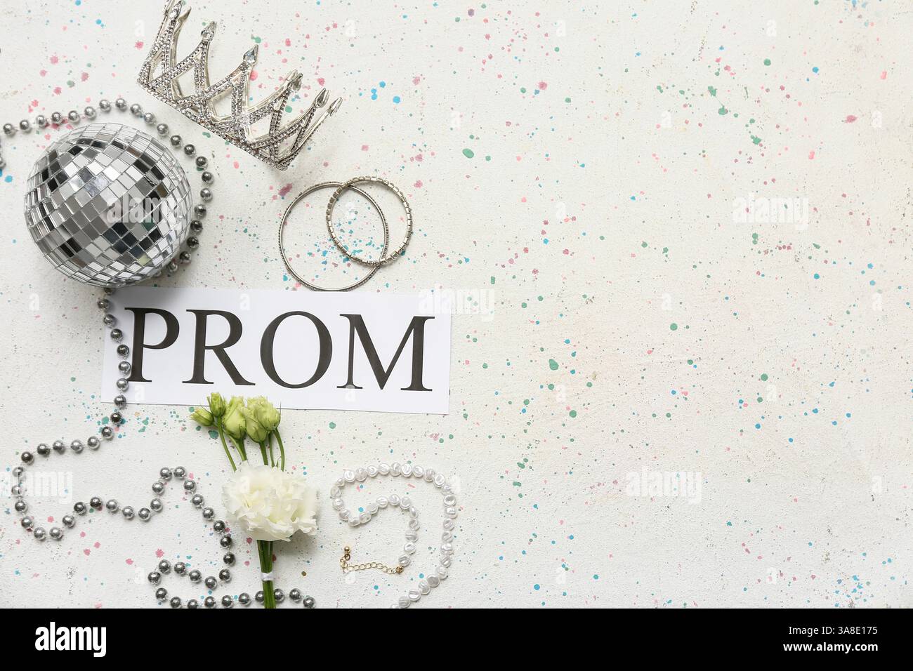 Word PROM with disco ball, boutonniere and accessories on light grunge ...