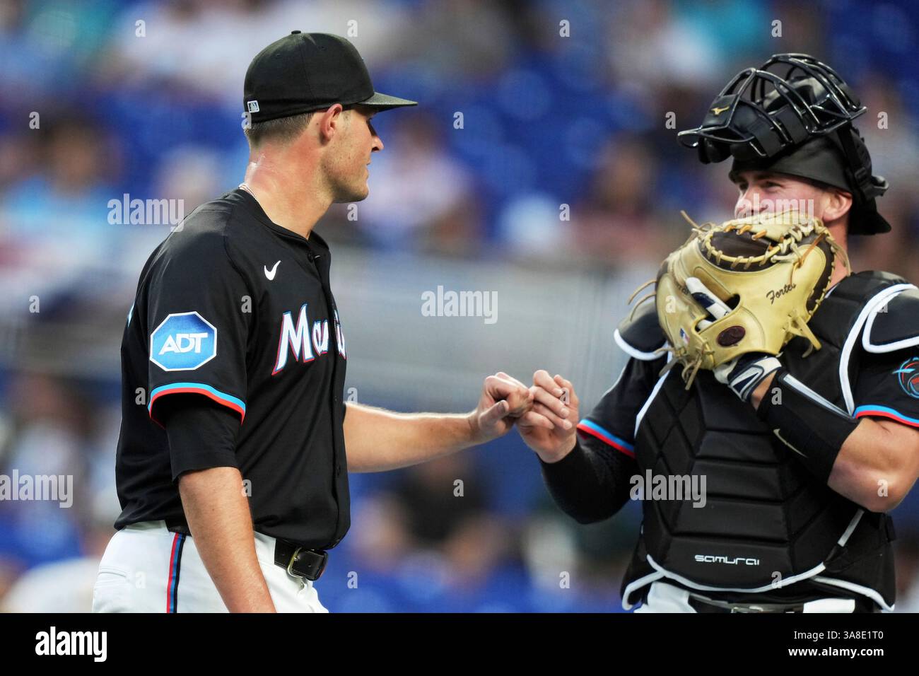 Miami Marlins pitcher Connor Gillispie, left, bumps fists with catcher ...