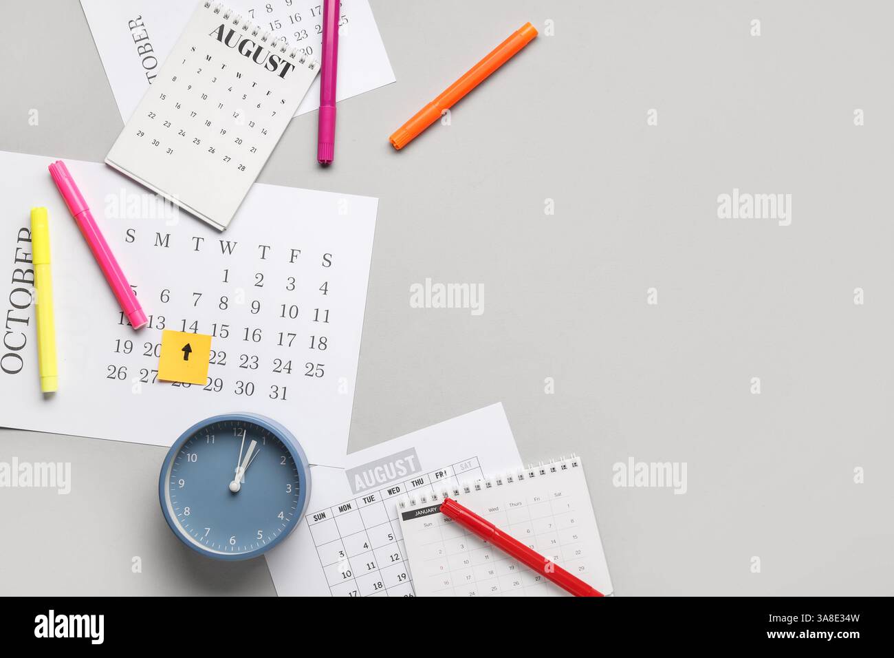 Calendars with alarm clock and markers on grey background with space ...
