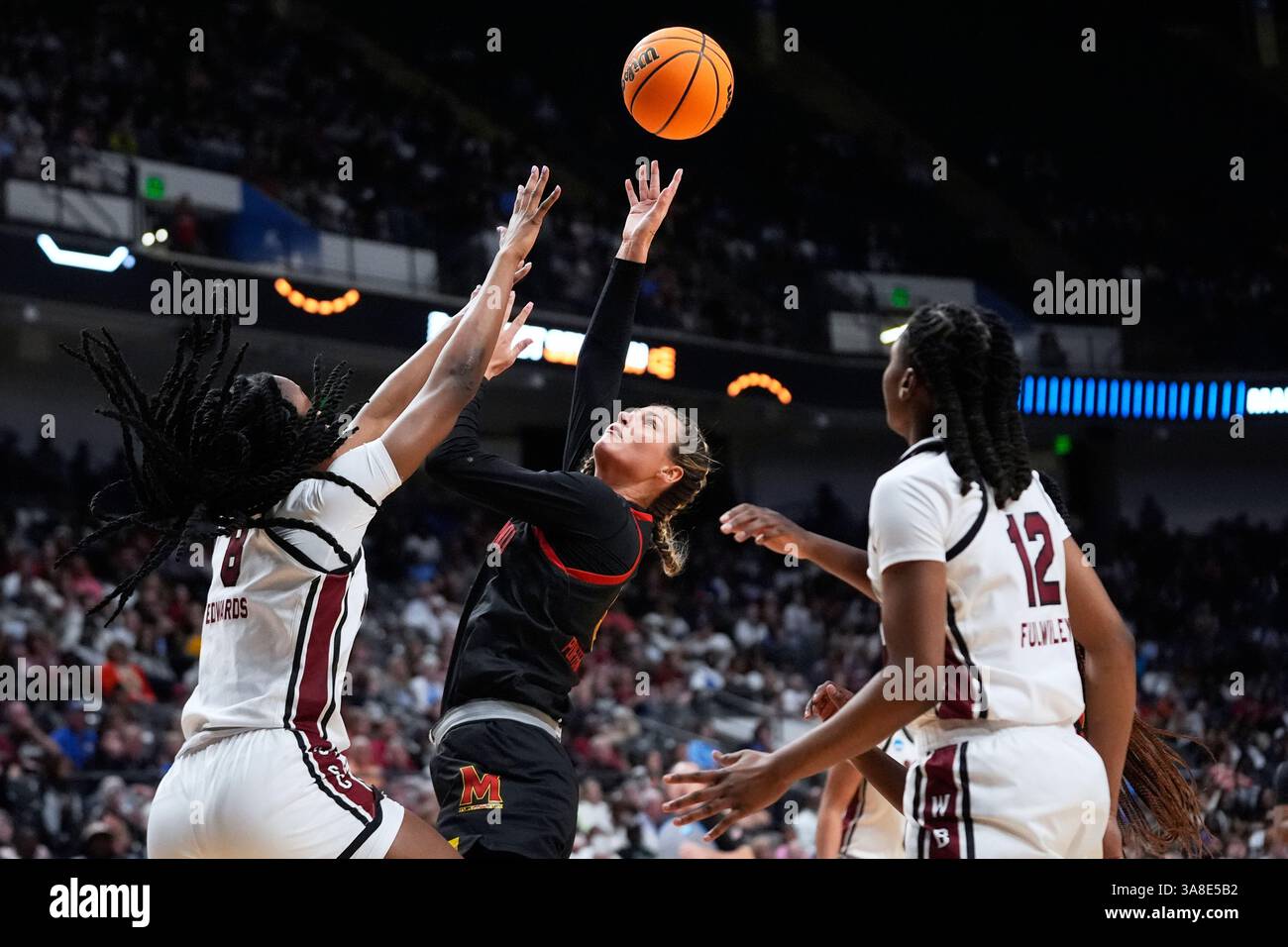 Maryland guard Saylor Poffenbarger shoots between South Carolina ...