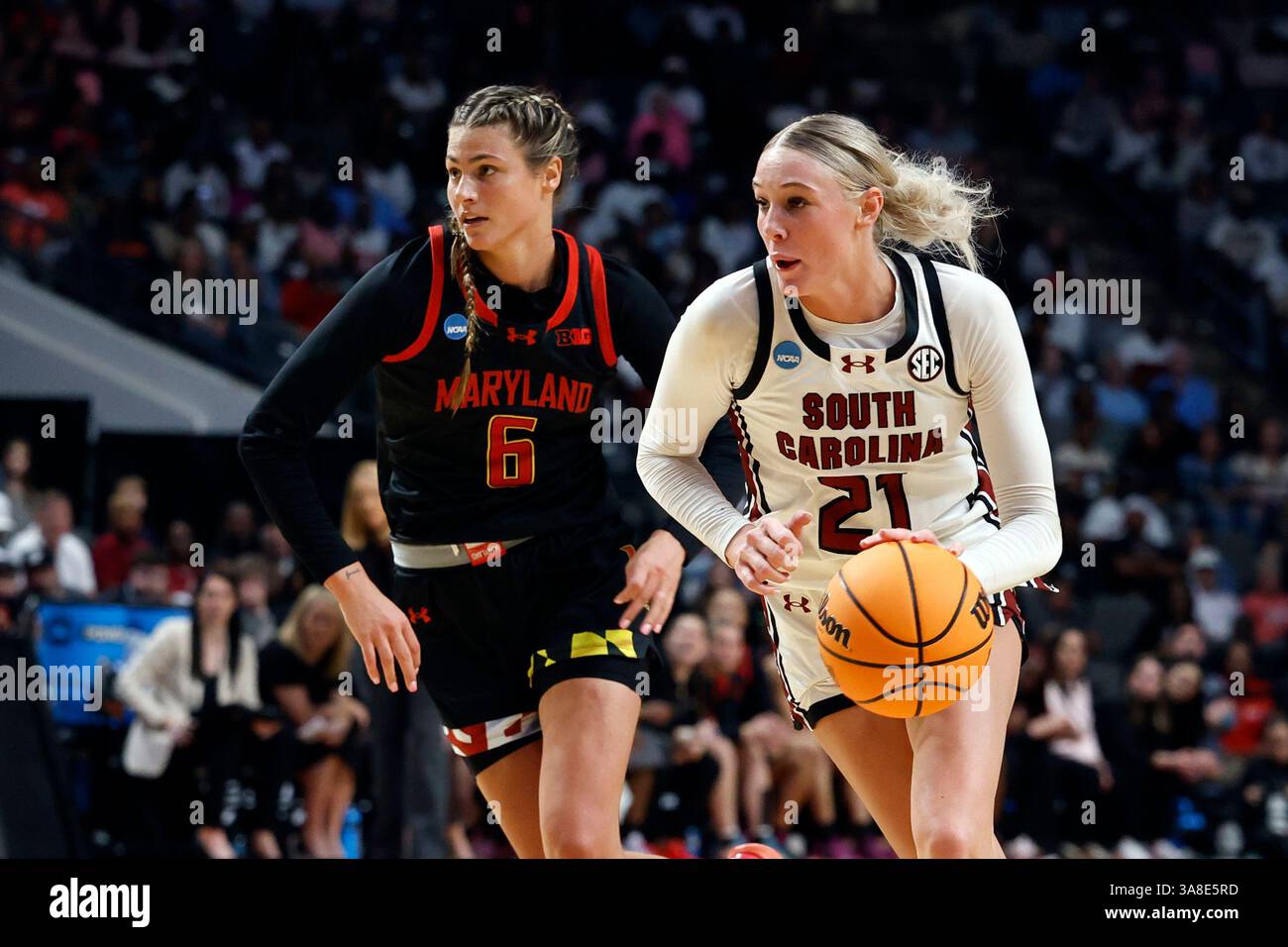 South Carolina forward Chloe Kitts (21) dribbles around Maryland guard ...