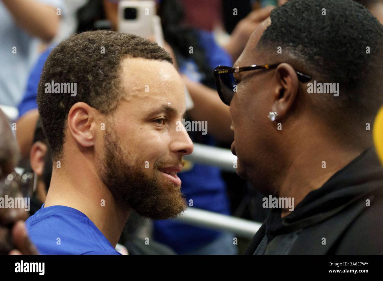 Golden State Warriors guard Stephen Curry, left, greets rapper Percy ...