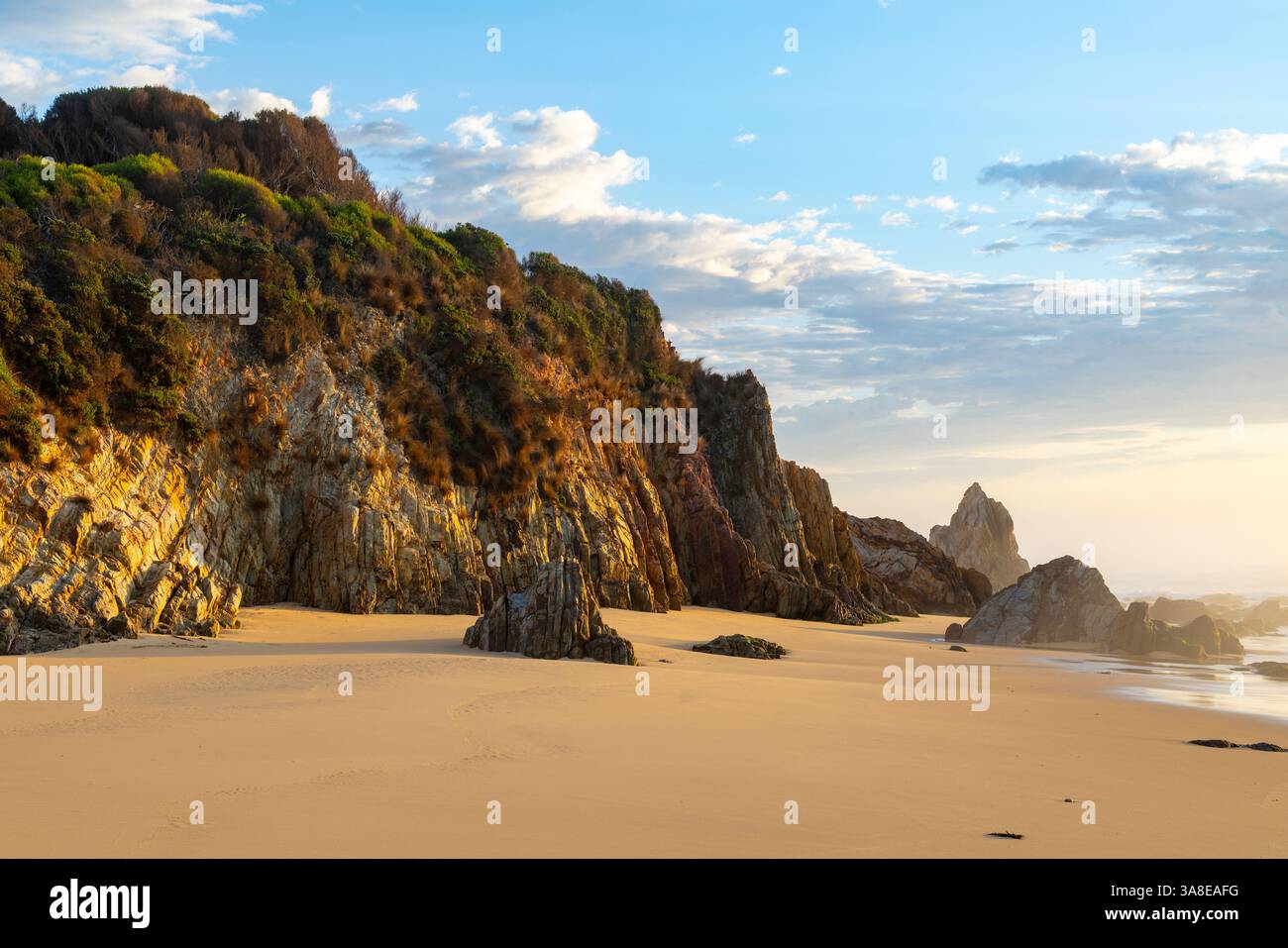 Australian rocky coastline at sunrise, Gillard's beach in Mimosa rocks ...