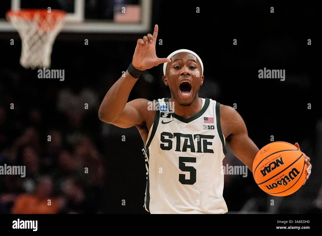 Michigan State guard Tre Holloman (5) reacts to play against ...