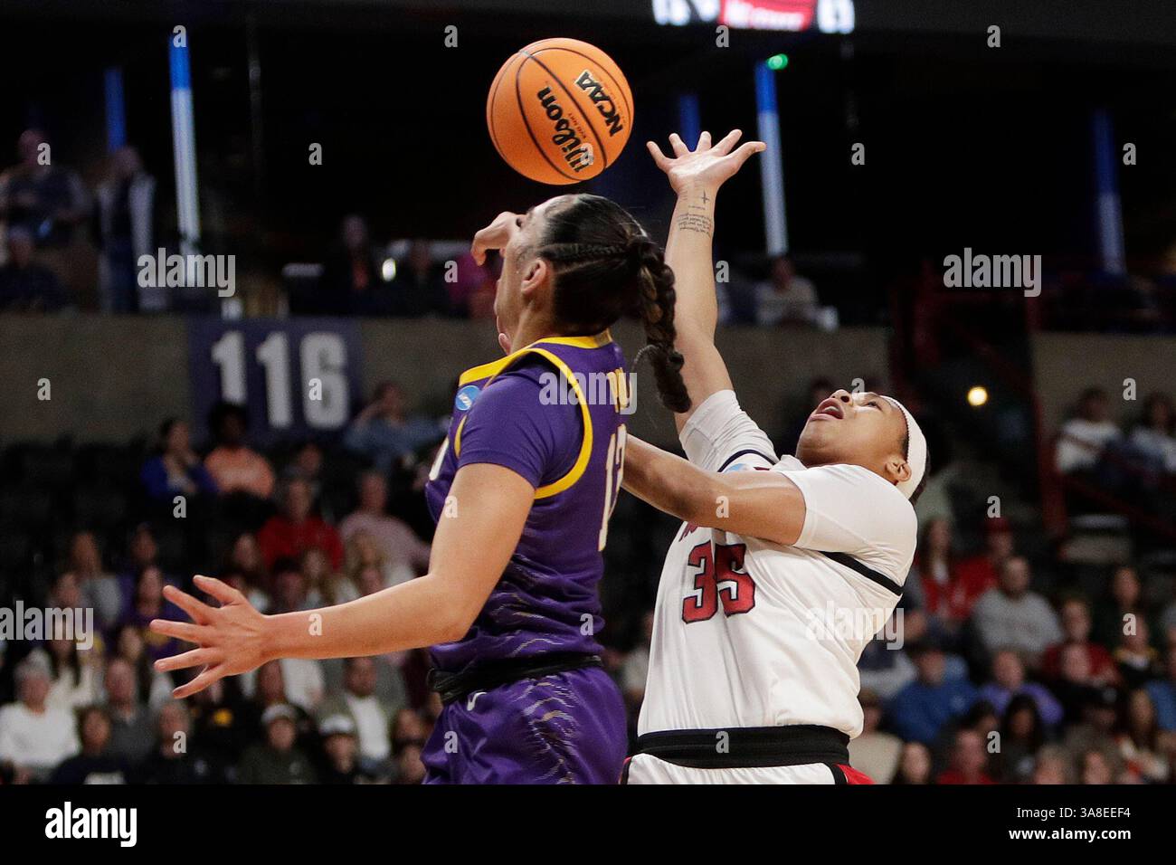 LSU guard Last-Tear Poa, left, blocks a shot by North Carolina State ...