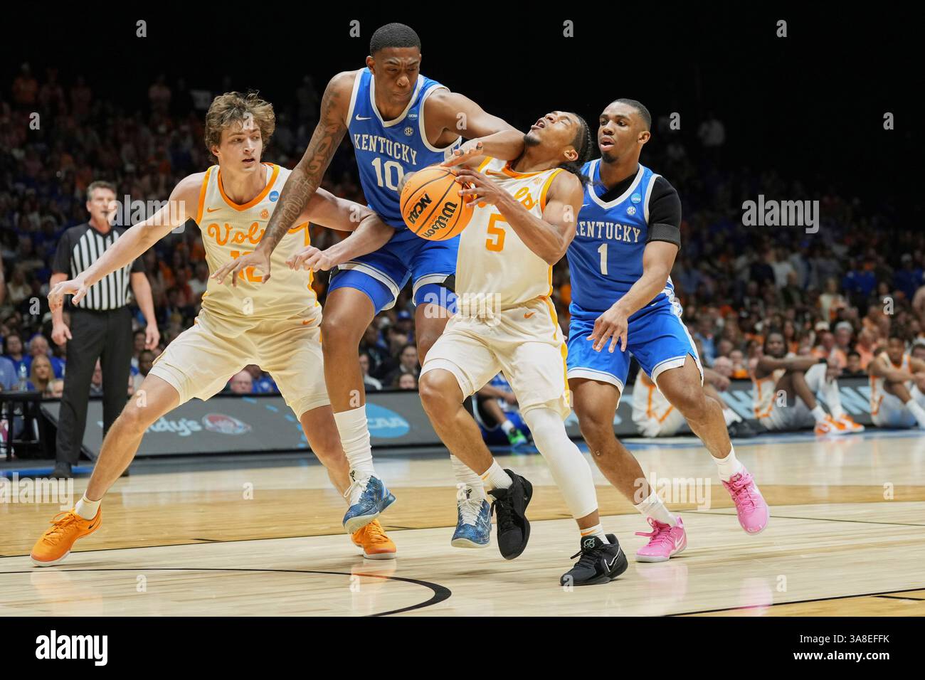 Tennessee's Zakai Zeigler (5) heads to the basket as Kentucky's Brandon ...