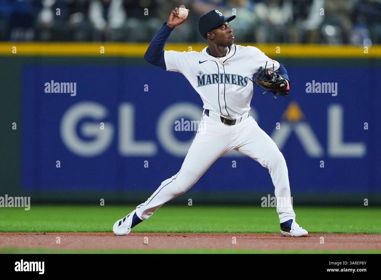 Seattle Mariners' Ryan Bliss makes a throw to first base against the ...