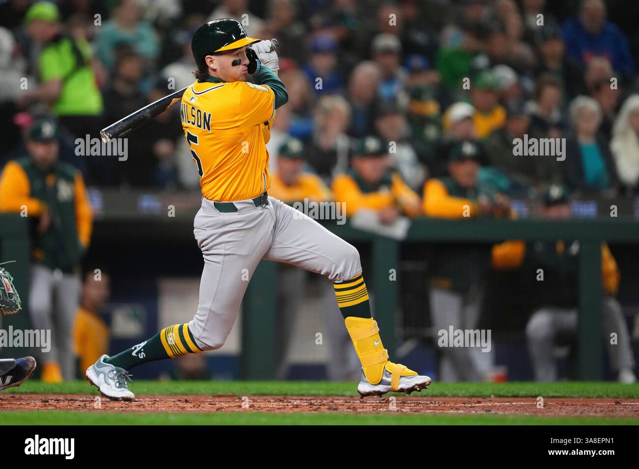 Athletics' Jacob Wilson follows through during an at-bat against the ...
