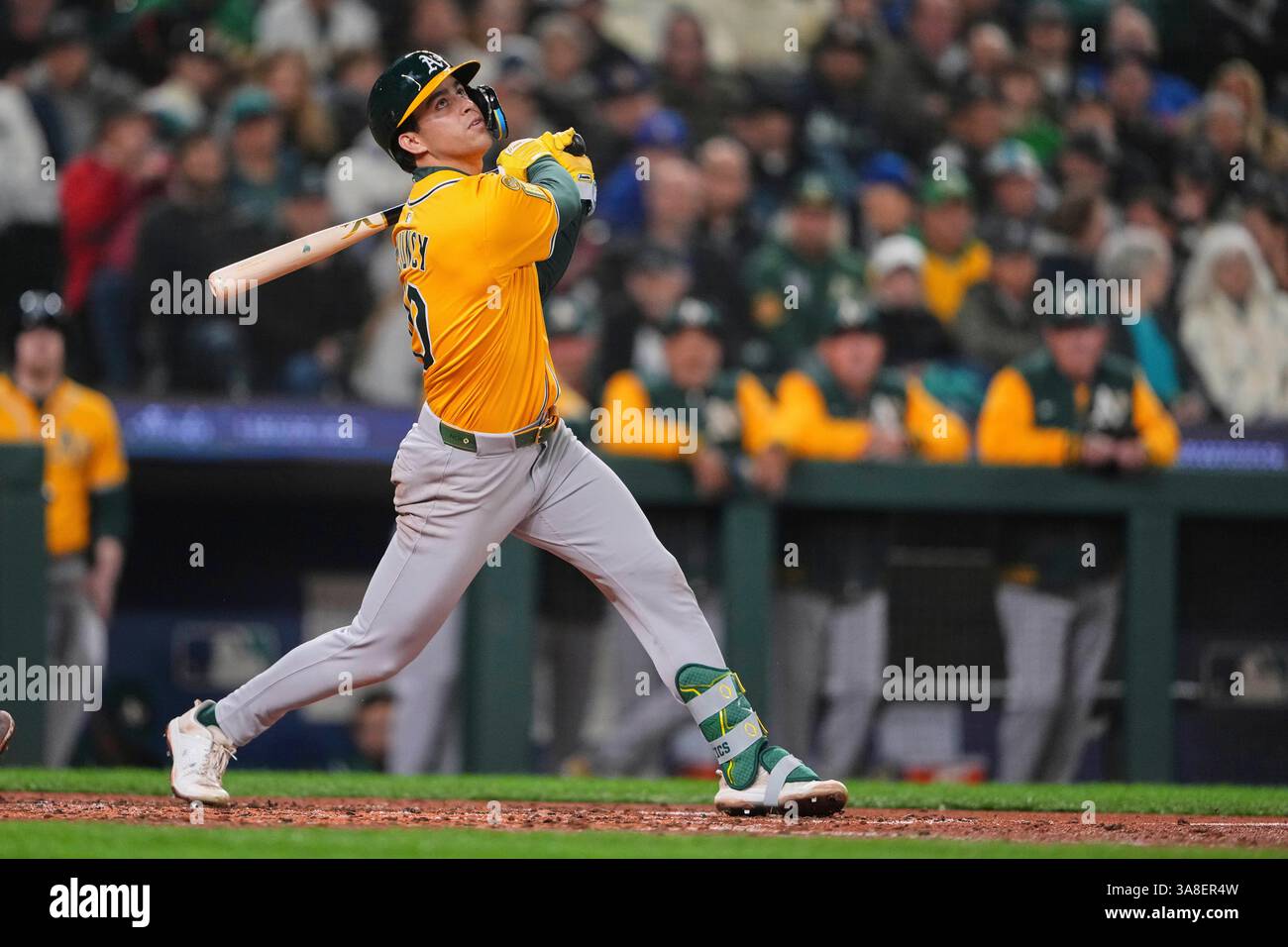 Athletics' Max Muncy swings during an at-bat against the Seattle ...