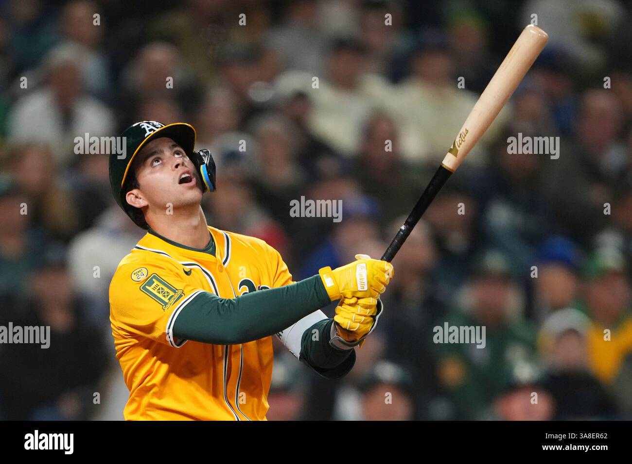 Athletics' Max Muncy swings during an at-bat against the Seattle Mariners during an opening-day ...