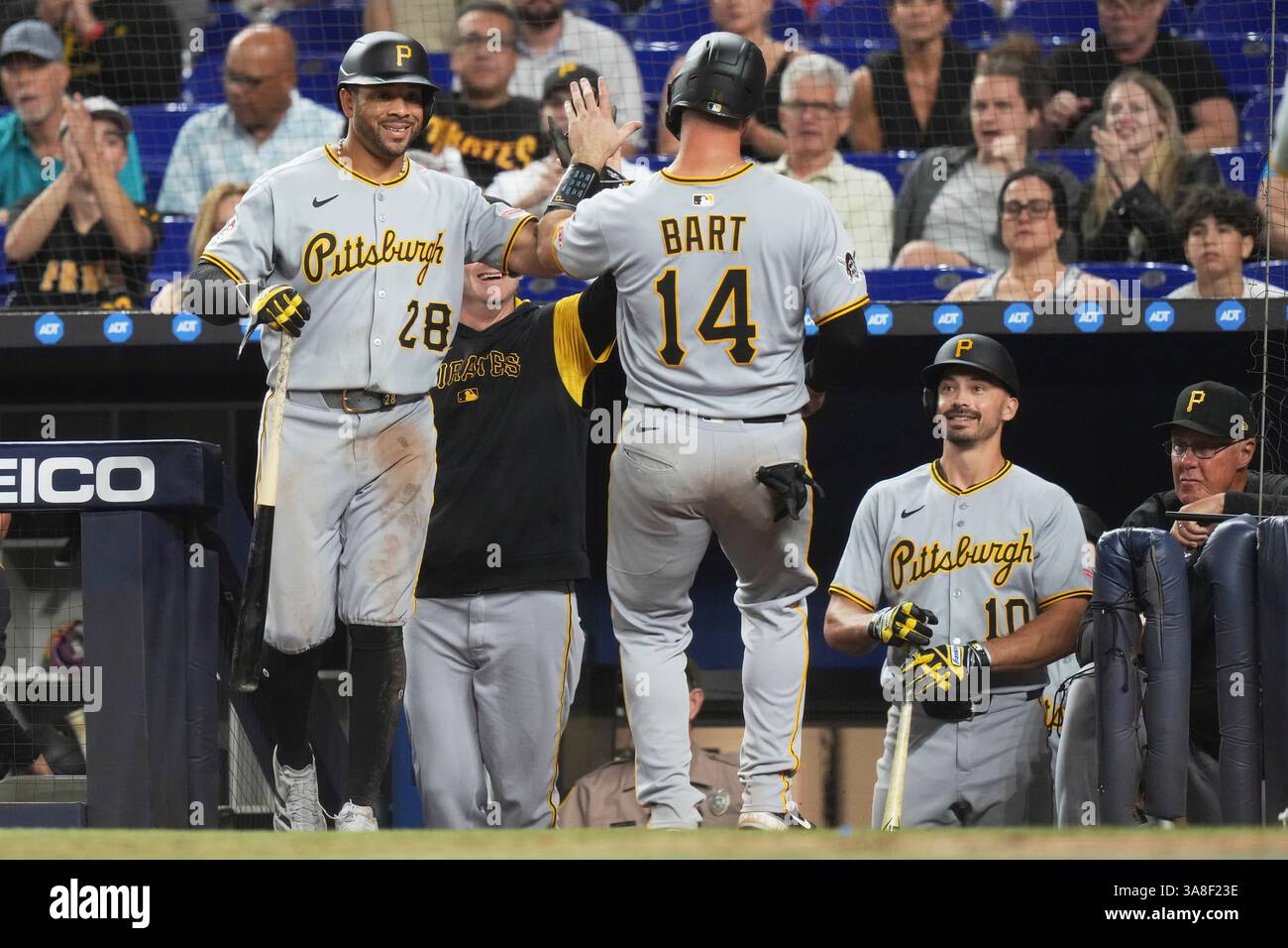 Pittsburgh Pirates' Joey Bart (14) is met by Tommy Pham (28) after ...