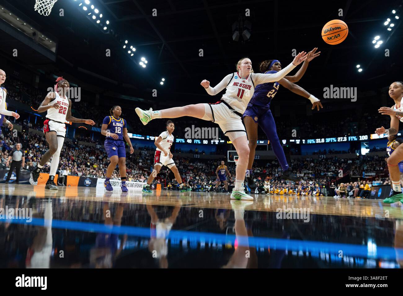 North Carolina State forward Maddie Cox (11) knocks the ball away from ...