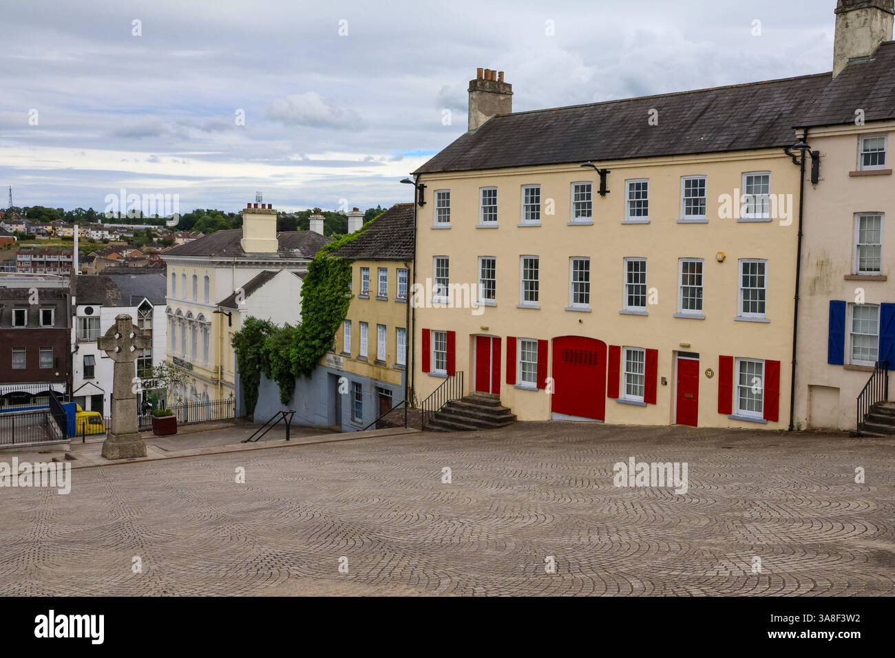 Paved Market Square with Celtic High Cross and buildings around the ...